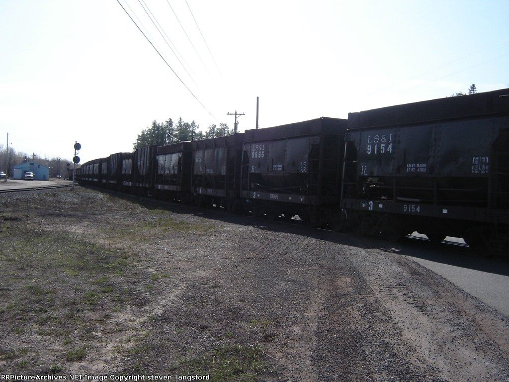 LOADED ORE CARS LEAVEING THE YARD